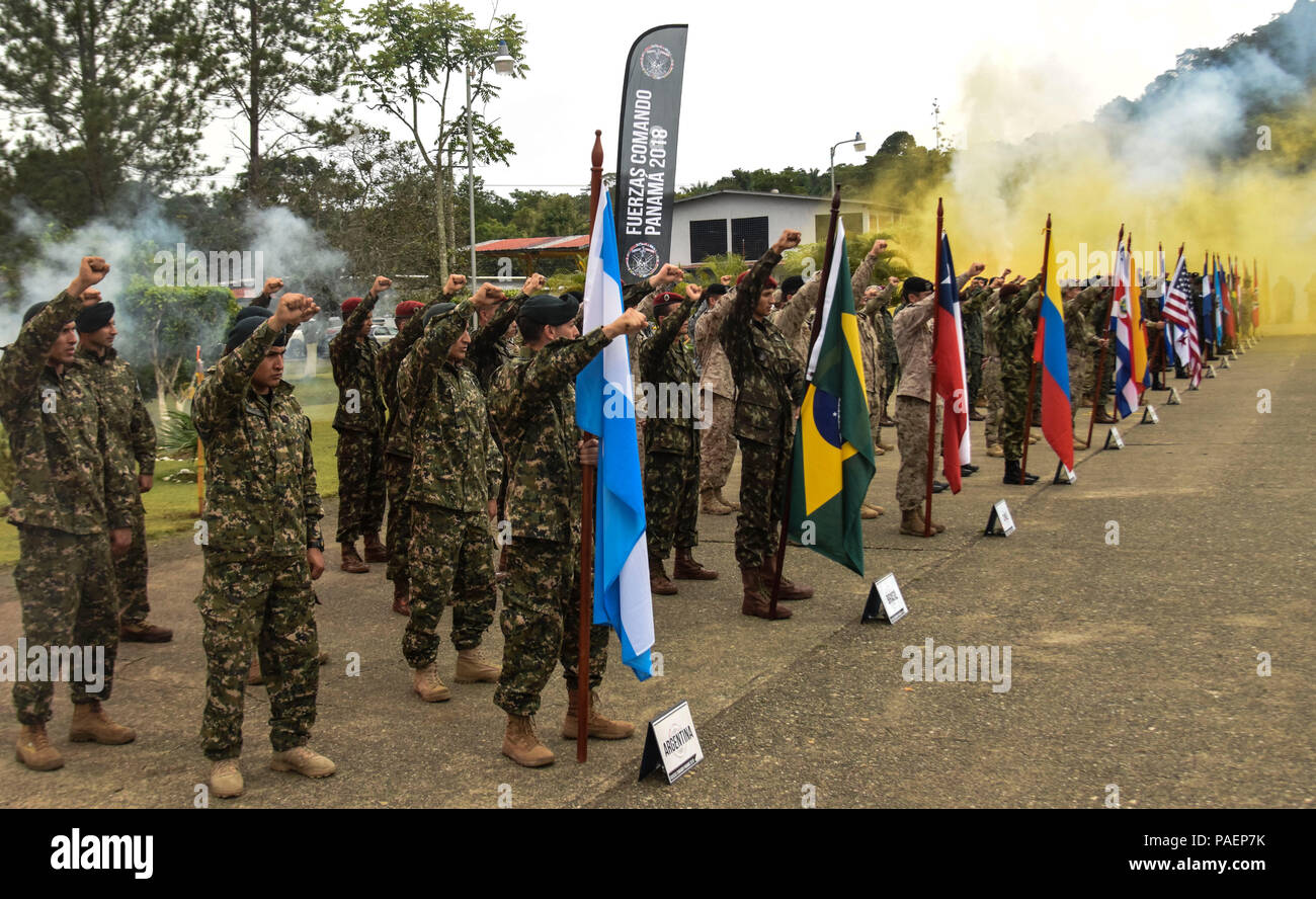 Participants of Fuerzas Comandos raise their fist and recite the ...