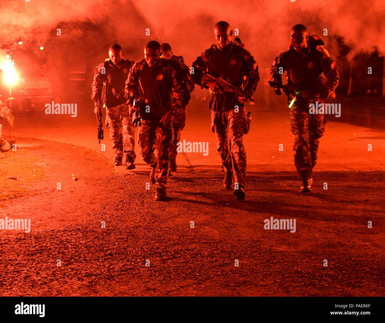 Haitian comandos step off from the starting point of a 20-kilometer ...