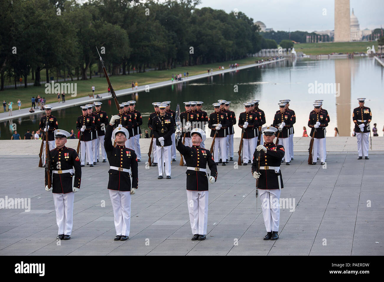 Marines with the U.S. Marine Corps Silent Drill Platoon execute their ...