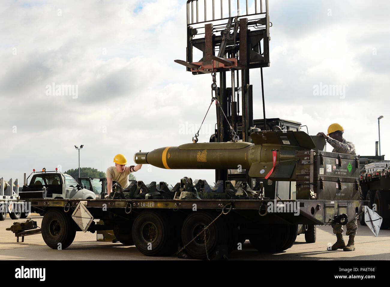 U.S. Air Force Munitions Airmen prepare a GBU-24 Paveway III laser ...