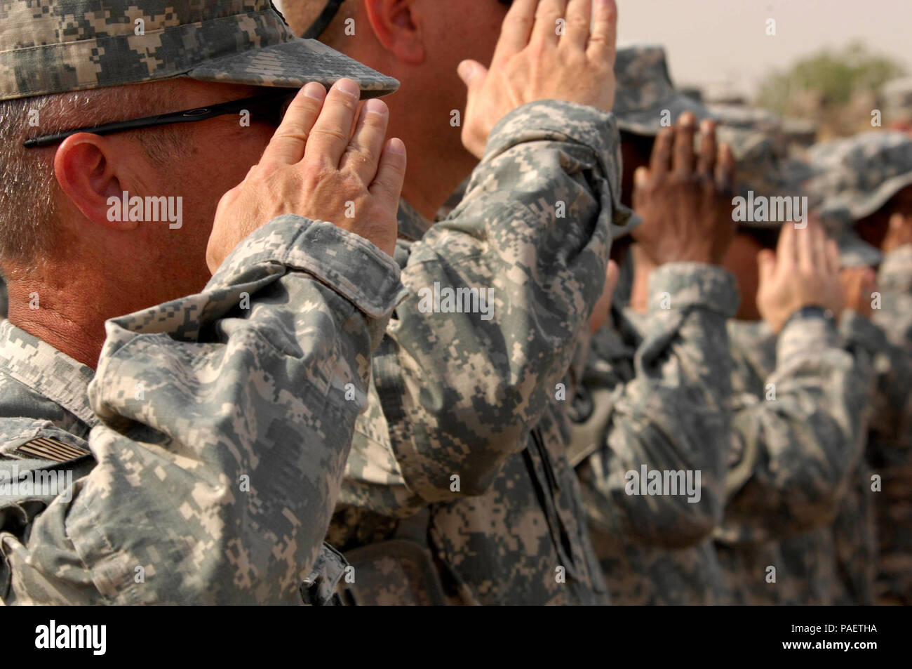 U.S. Soldiers salute during a Sept. 11, 2001, memorial. Members of MND ...