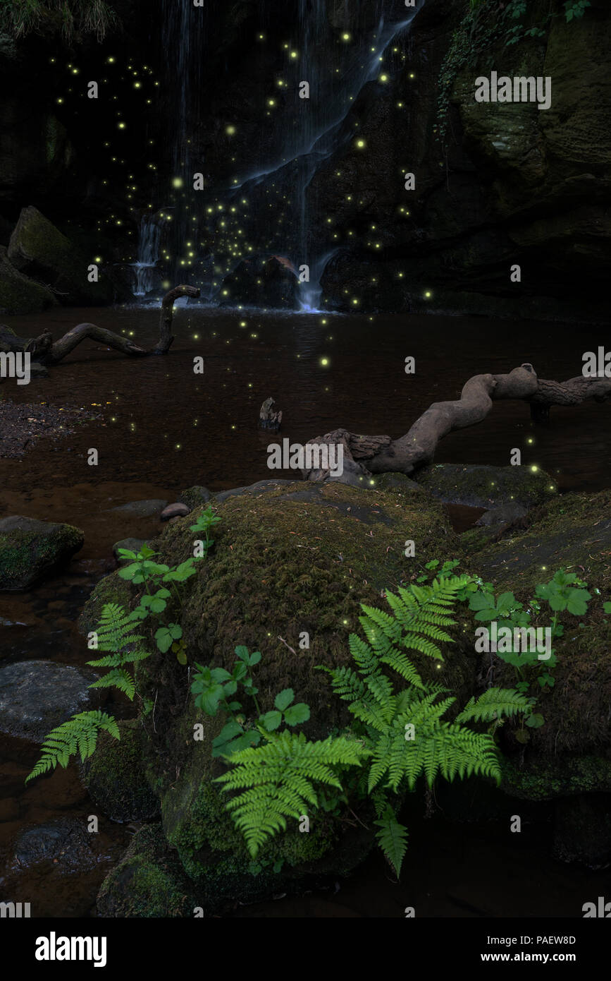 Stunning waterfall landscape at dusk with fireflies glowing around ...