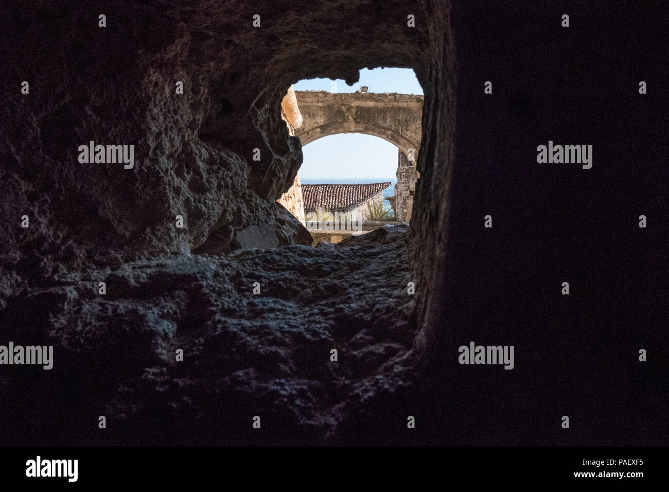Arc of a medieval castle from a hole of an ancient stone wall Stock ...