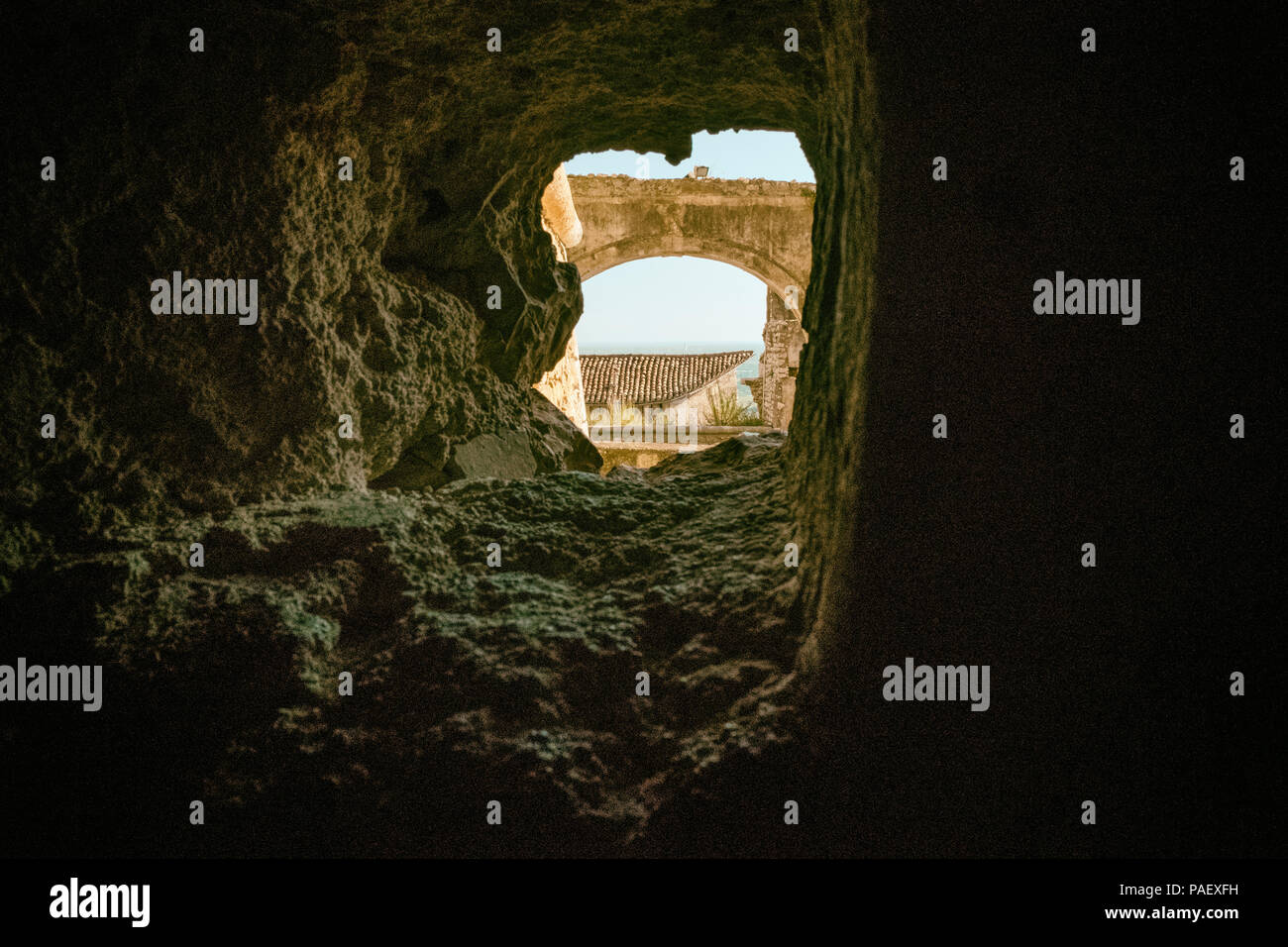 Arc of a medieval castle from a hole of a stone wall Stock Photo - Alamy