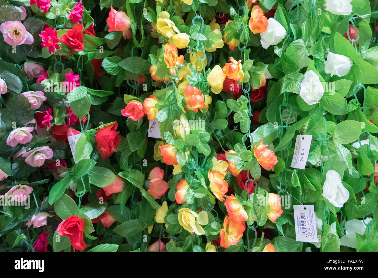 Beautiful multicolored artificial flowers with tags background Stock ...