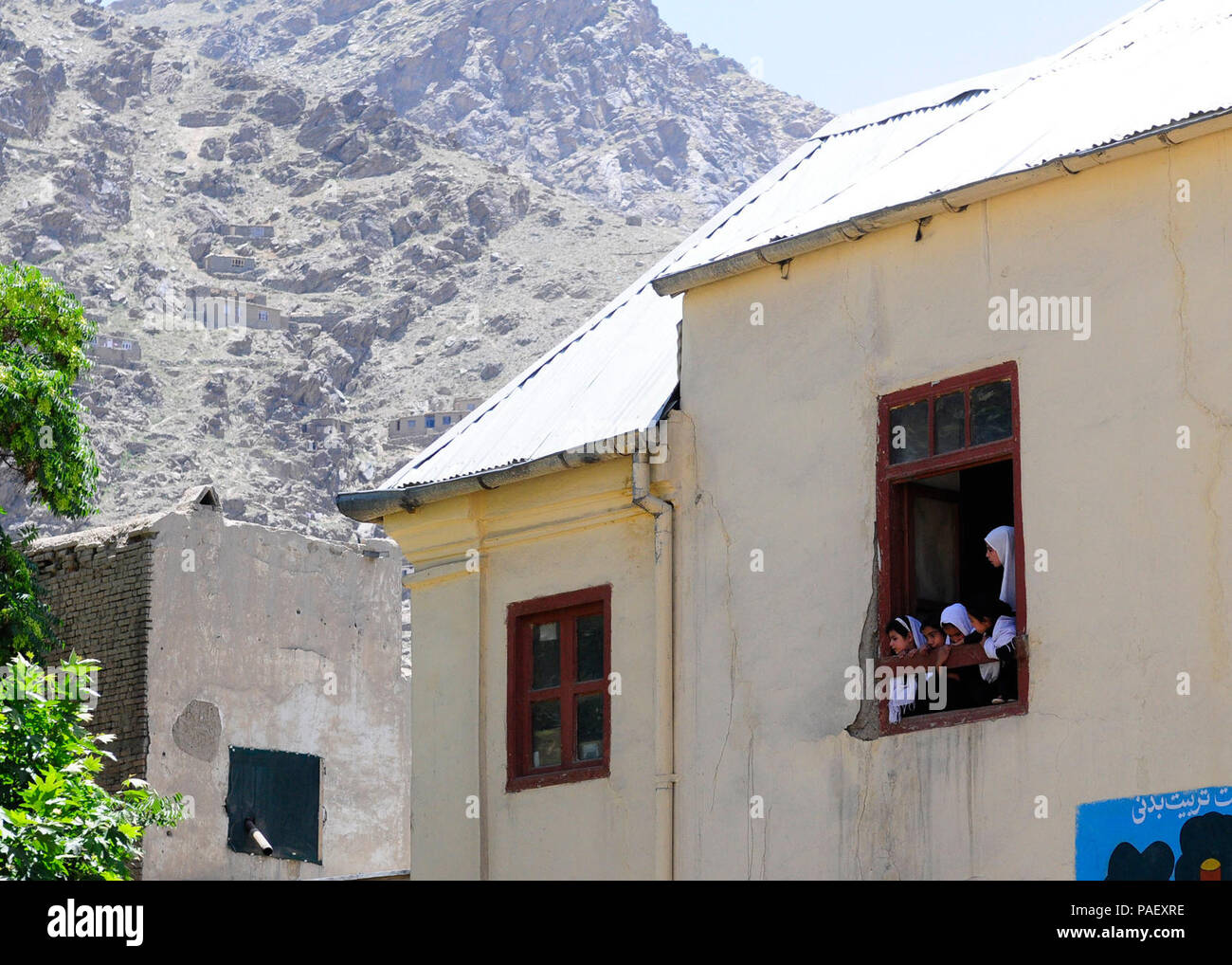 KABUL, Afghanistan – A classroom of Afghan girls look out their window ...