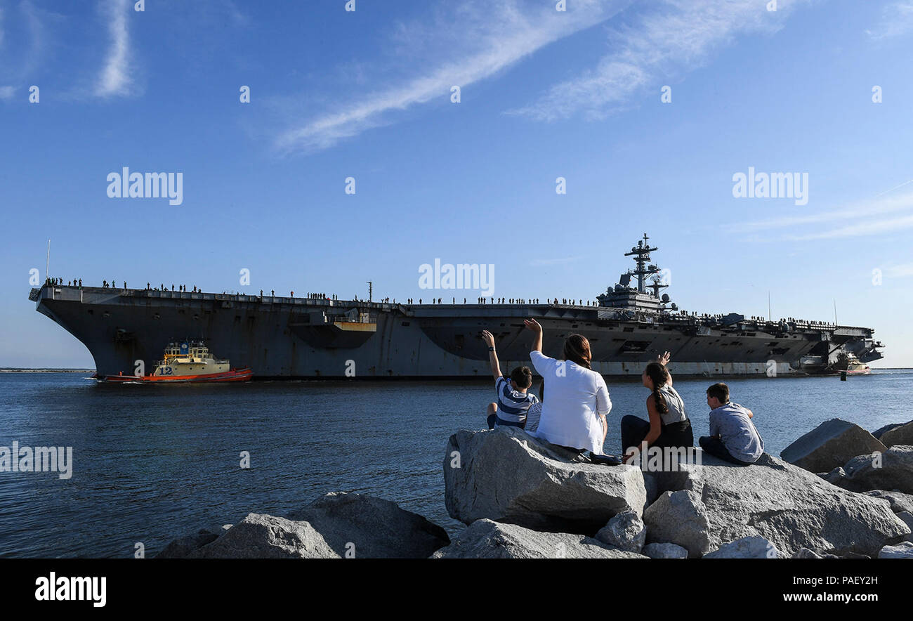 Fla. (Aug. 19, 2017) A family waves as the the Nimitz-class aircraft ...