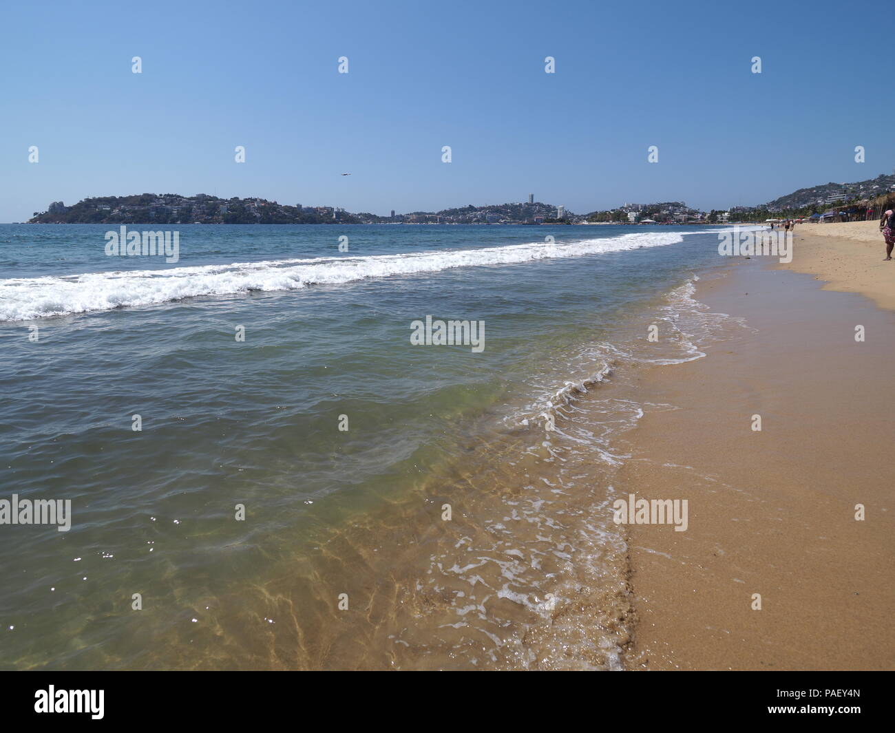 Sandy beach at quiet landscapes of bay of ACAPULCO city in Mexico with ...
