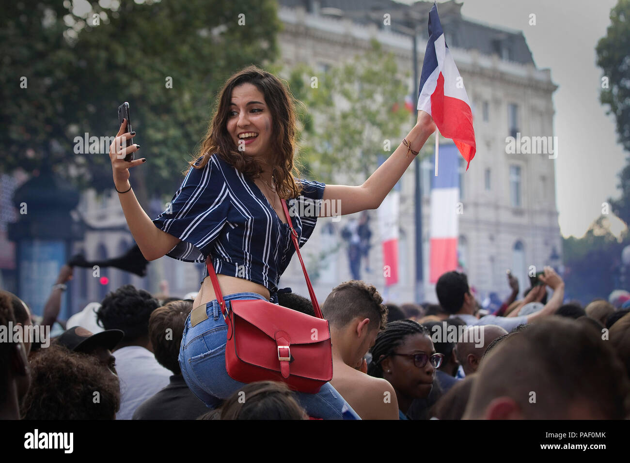 French fans celebrate on the Champs-Elysees avenue after France won the ...