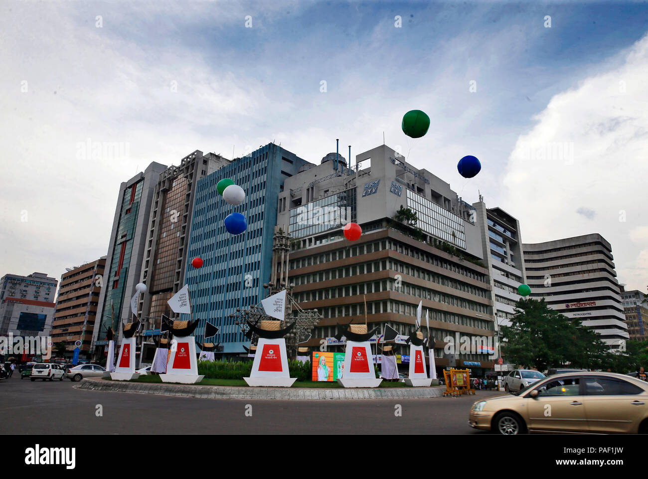 A road island in the capital decorated with the logo of Bangladesh ...