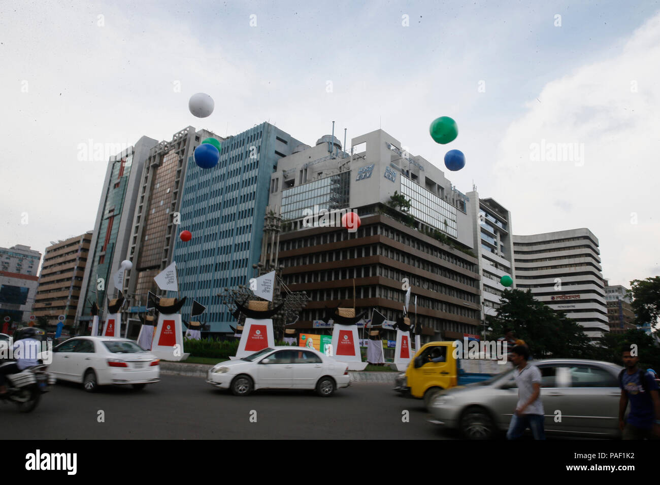 A road island in the capital decorated with the logo of Bangladesh ...