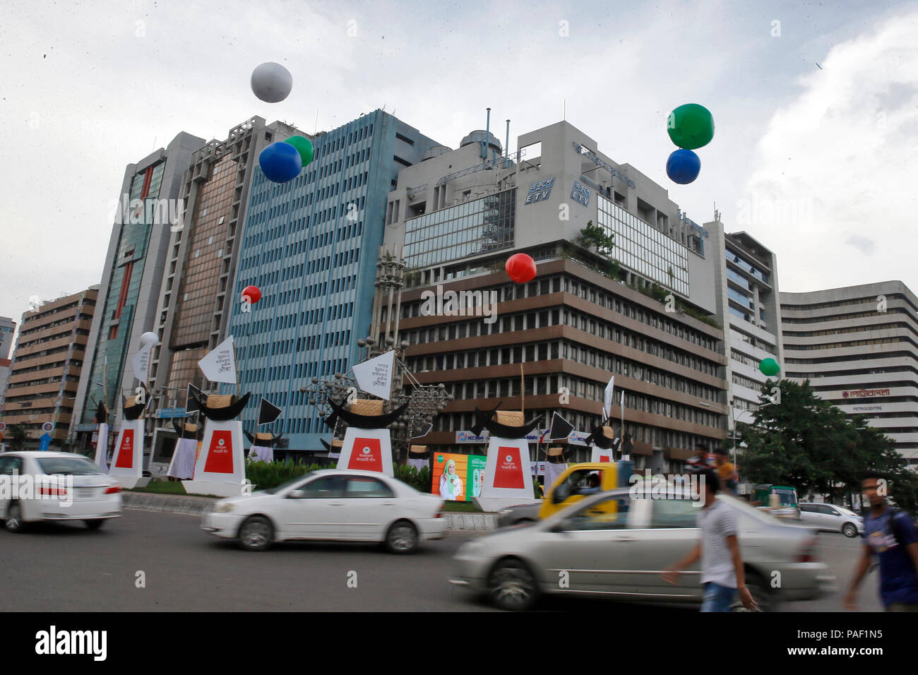 A road island in the capital decorated with the logo of Bangladesh ...