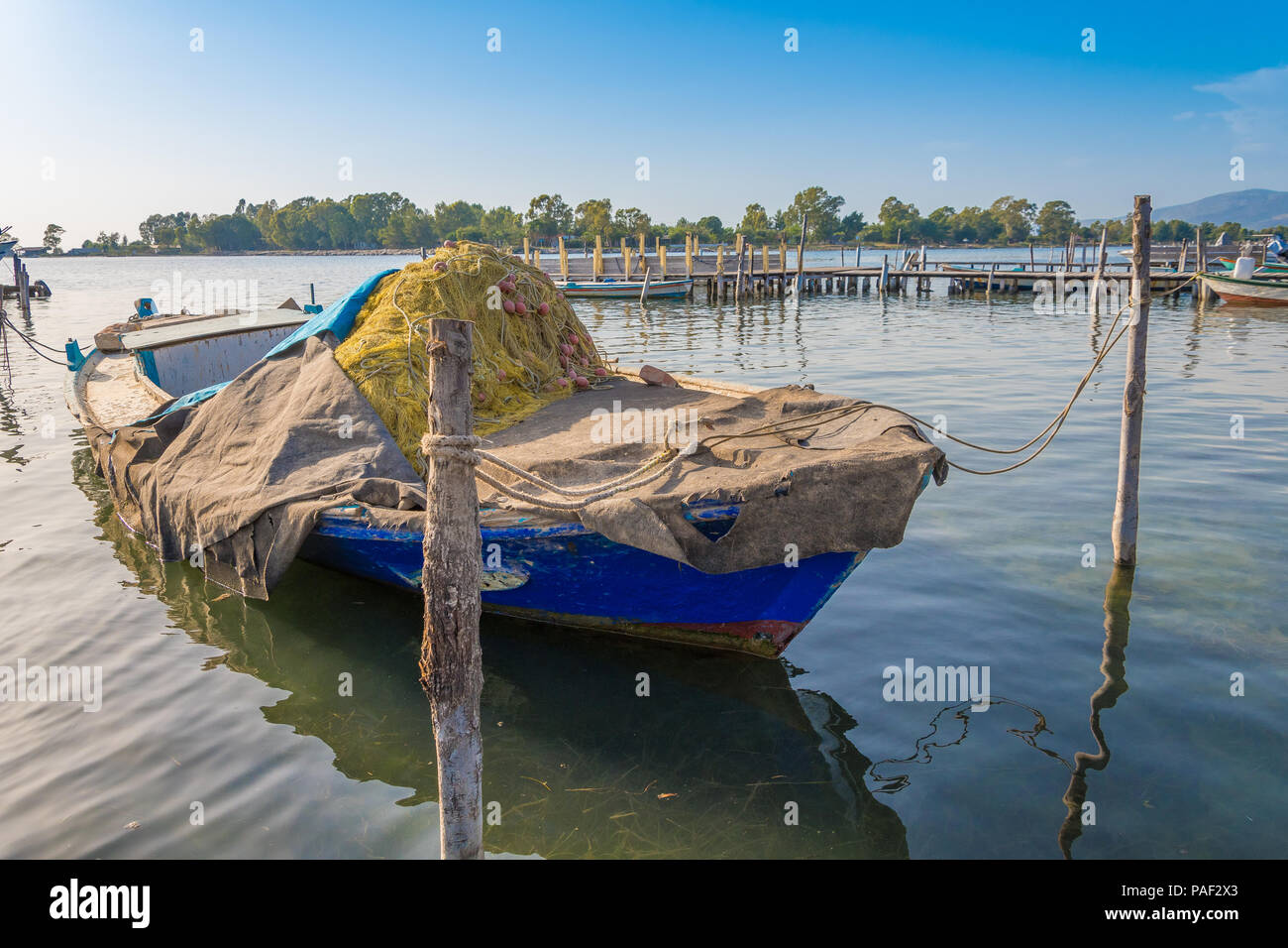 A traditional fishing boat in the sea lagoon of Mesolongi in Greece ...