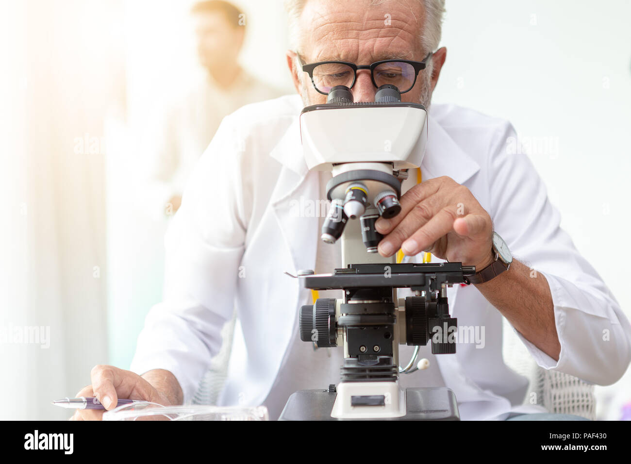 Man in laboratory with microscope hi-res stock photography and images ...