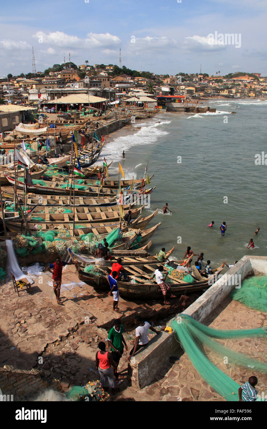 People bathing in the waves of the ocean in front of the stunning ...