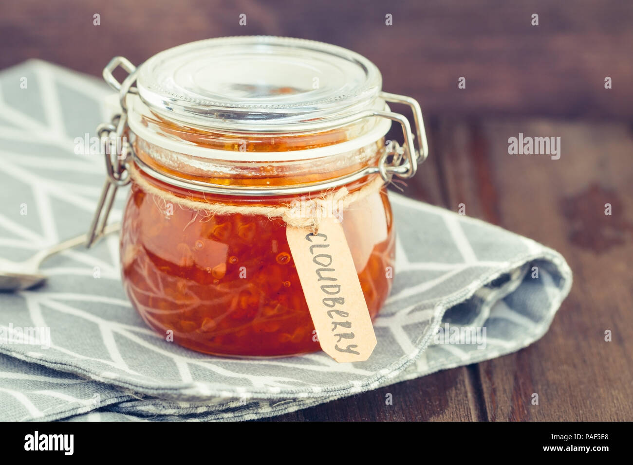 Glass jar with cloudberry jam. Nordic cuisine Stock Photo - Alamy