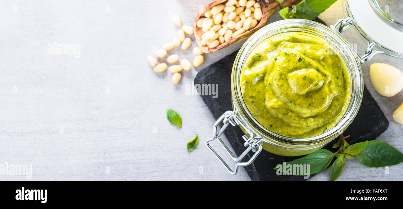 Pesto sauce in glass jar Stock Photo - Alamy