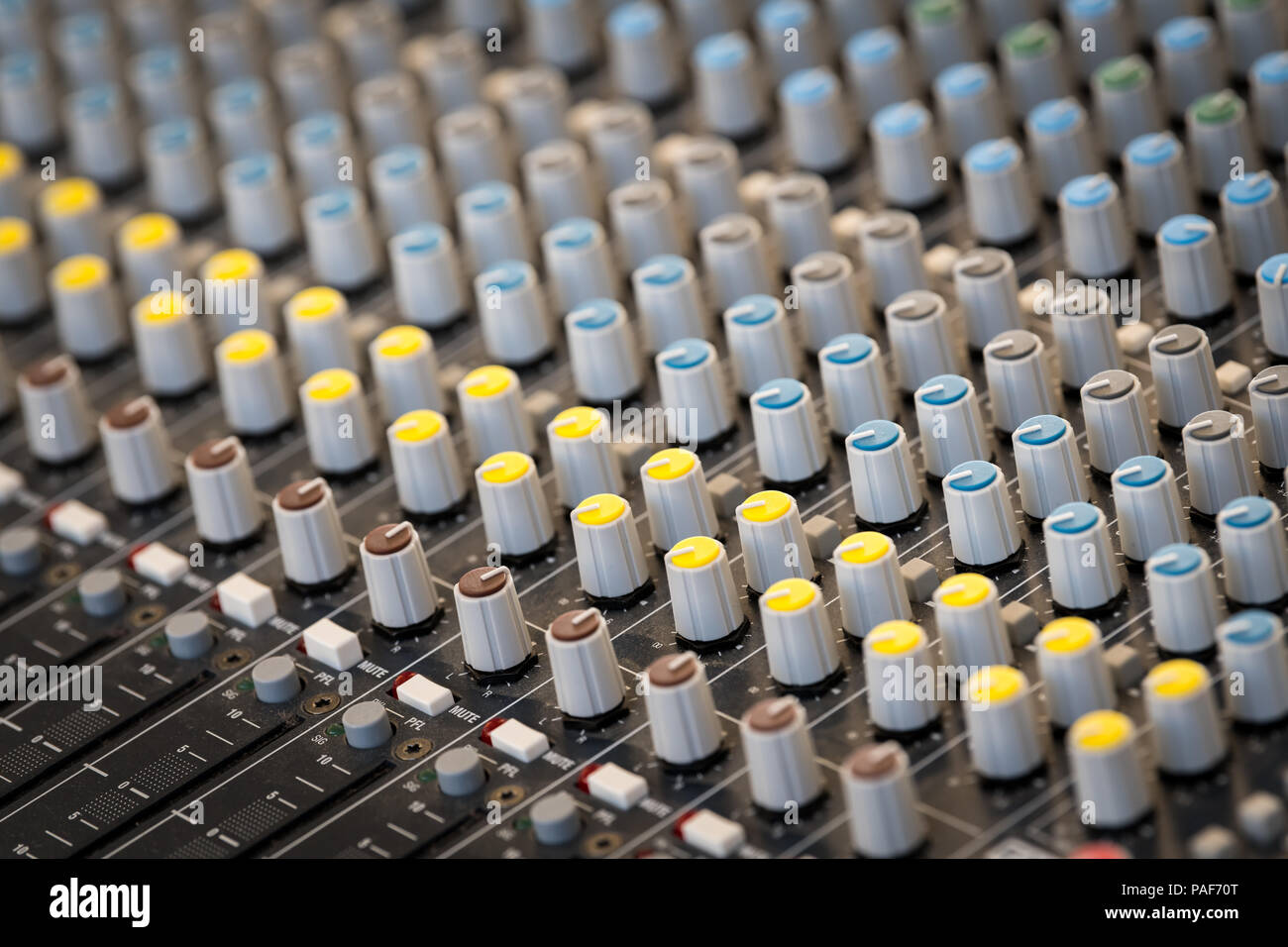 Detail of a sound mixing panel with various knobs Stock Photo - Alamy