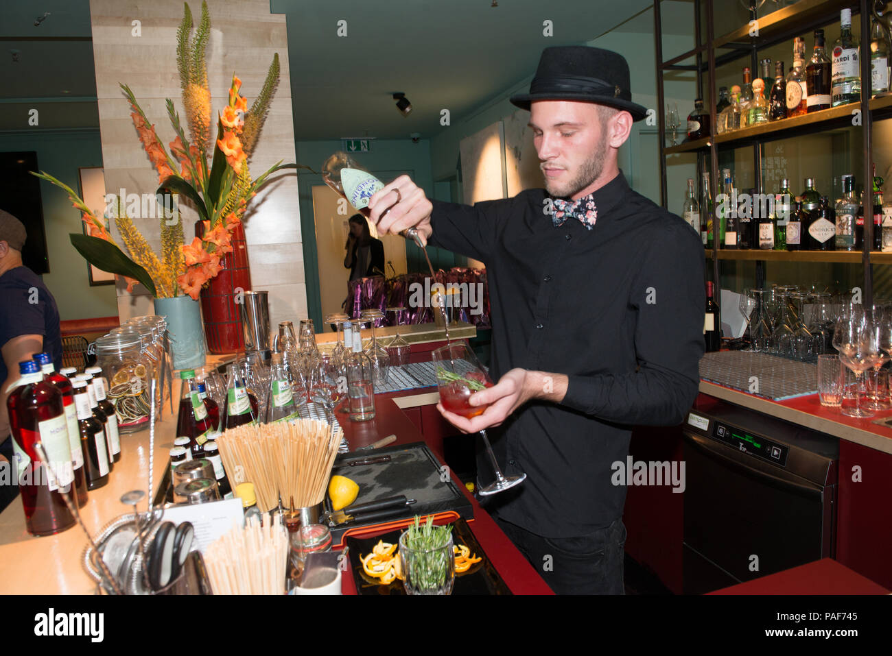 Bartender mixing drinks at the Heart Club in Munich Stock Photo - Alamy