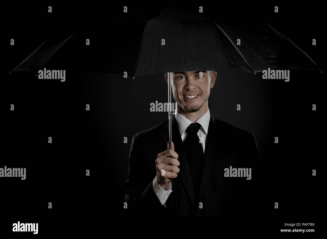 portrait man in black costume with umbrella, special-service agent ...