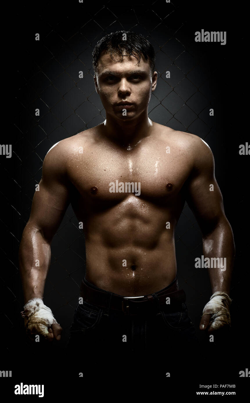 vertical photo muscular young guy street-fighter, aggression look Stock ...