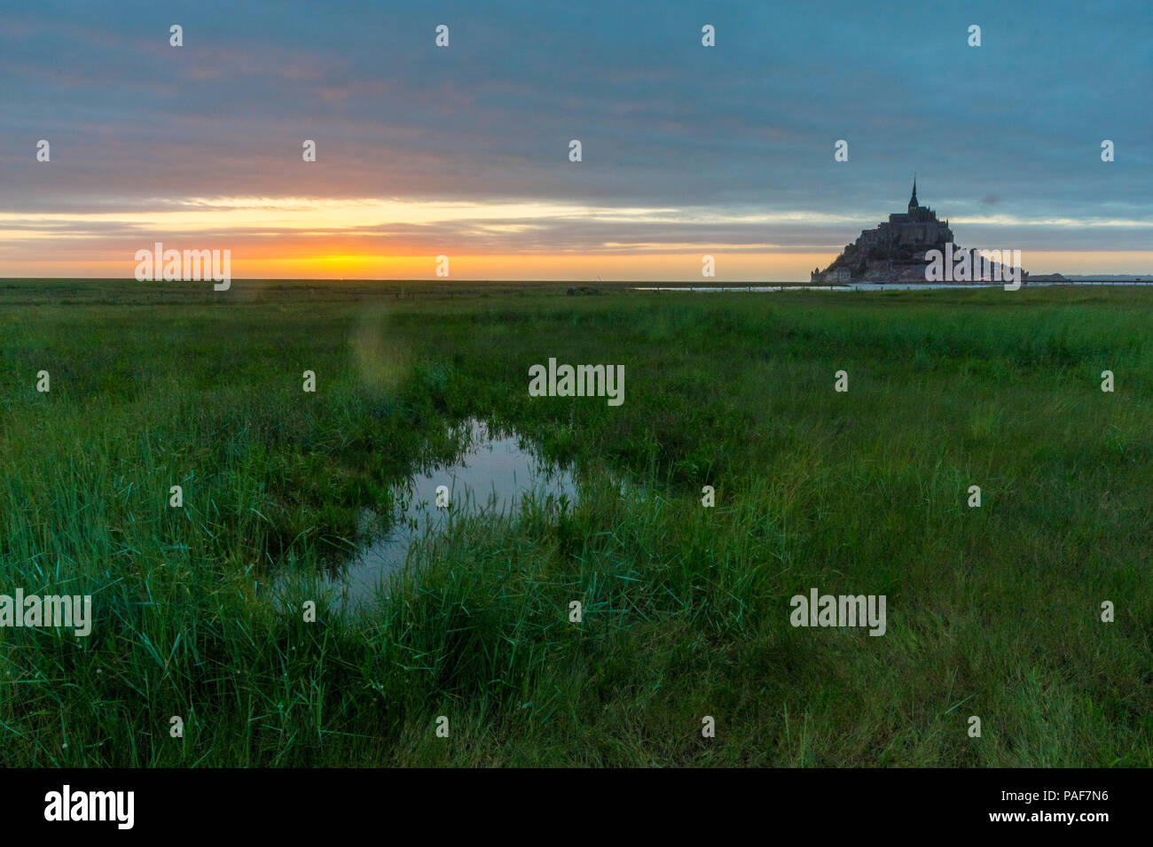 Mont st. Michel, Normandy, France. A half-flooded field in front of the ...