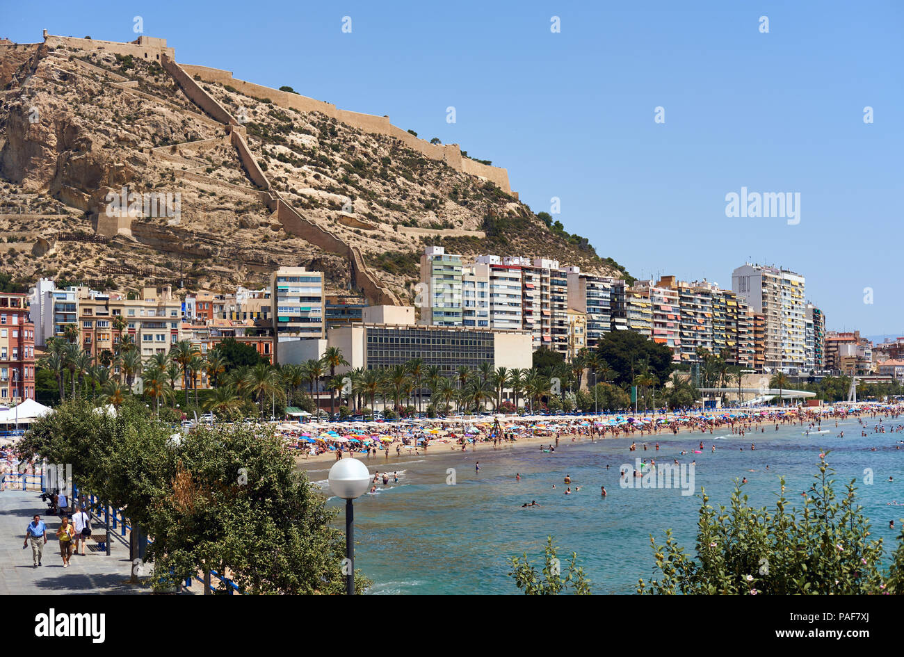 Alicante, Spain - June 26, 2018: Tourists sunbathing on a Postiguet ...