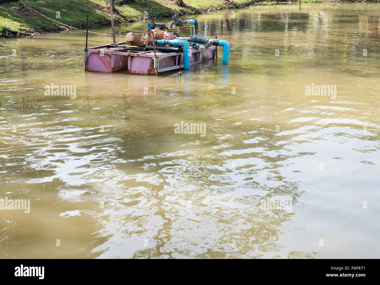 Water pump station is floating on the reservoir in the countryside farm ...