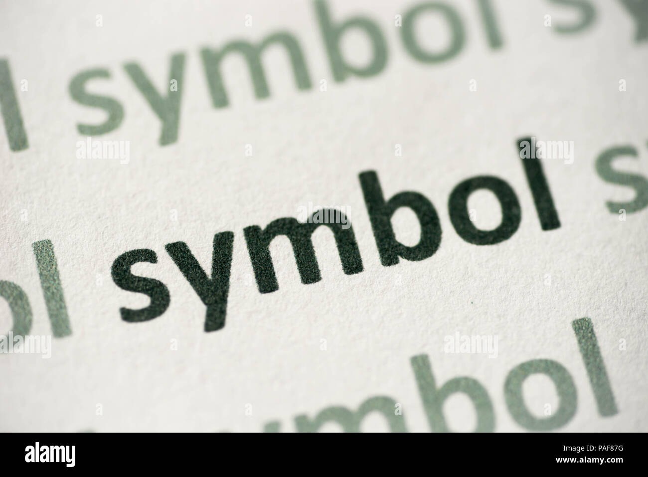 word symbol printed on white paper macro Stock Photo - Alamy