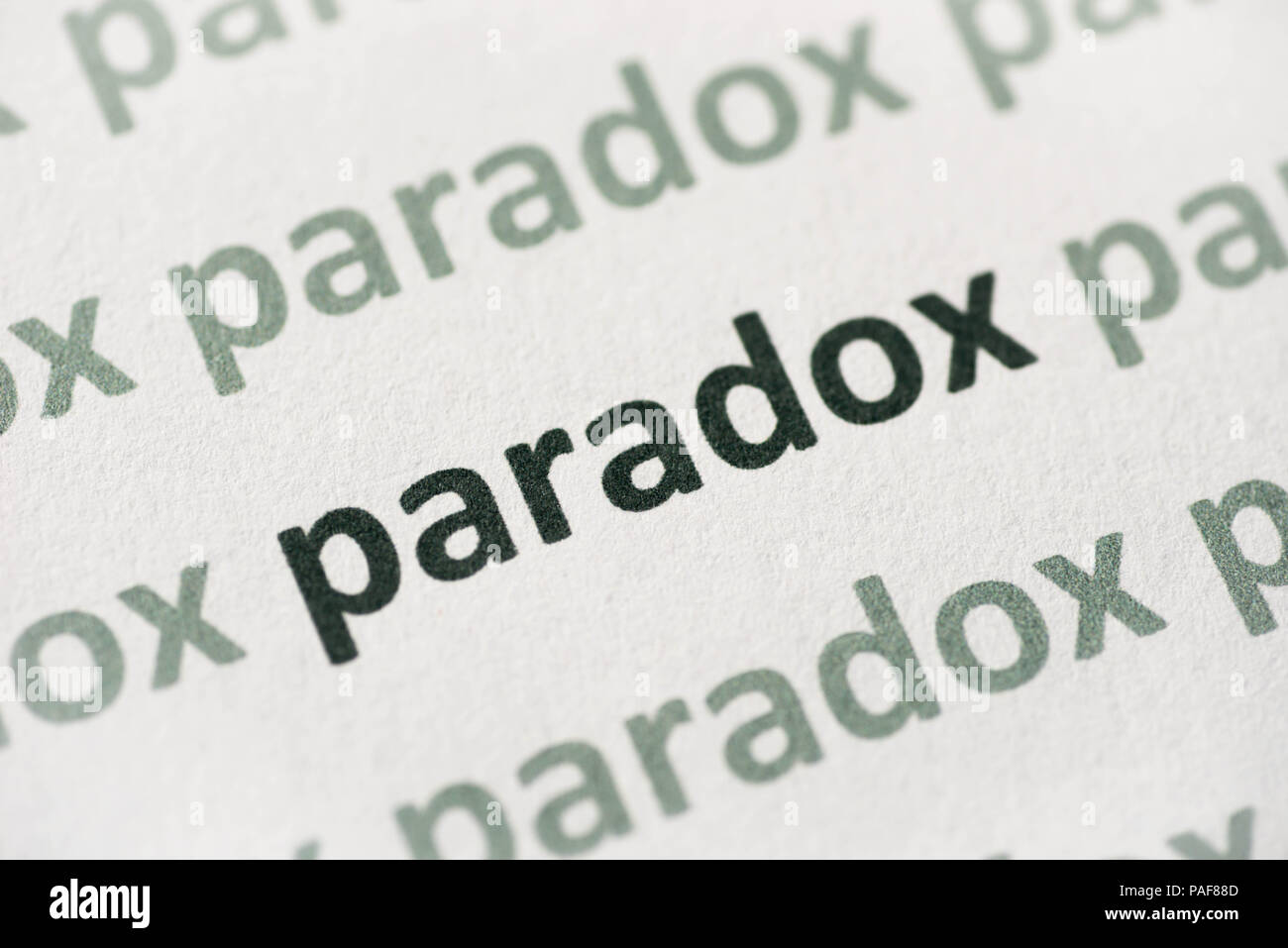 word paradox printed on white paper macro Stock Photo - Alamy