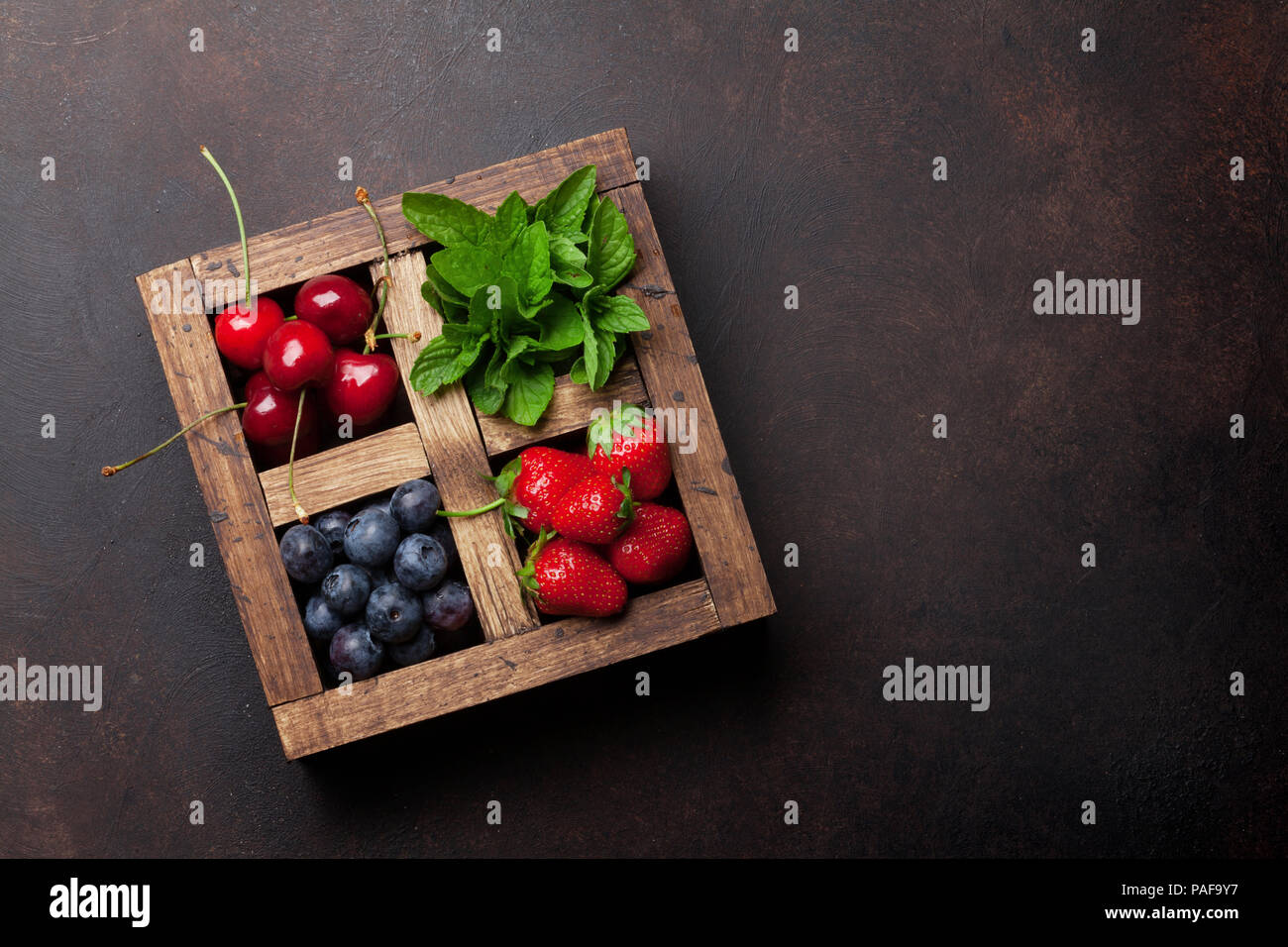 Fresh summer berries box. Cherry, blueberry, strawberry and mint. Top ...