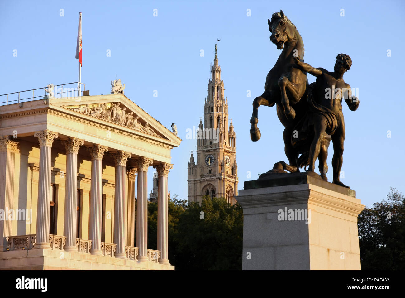 The Austrian Parliament, Statue of man and the horse and Rathaus in ...