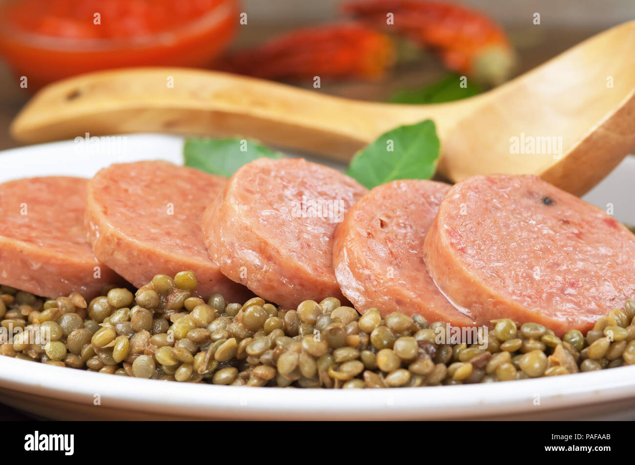 Italian cotechino with lentils on Christmas table Stock Photo - Alamy