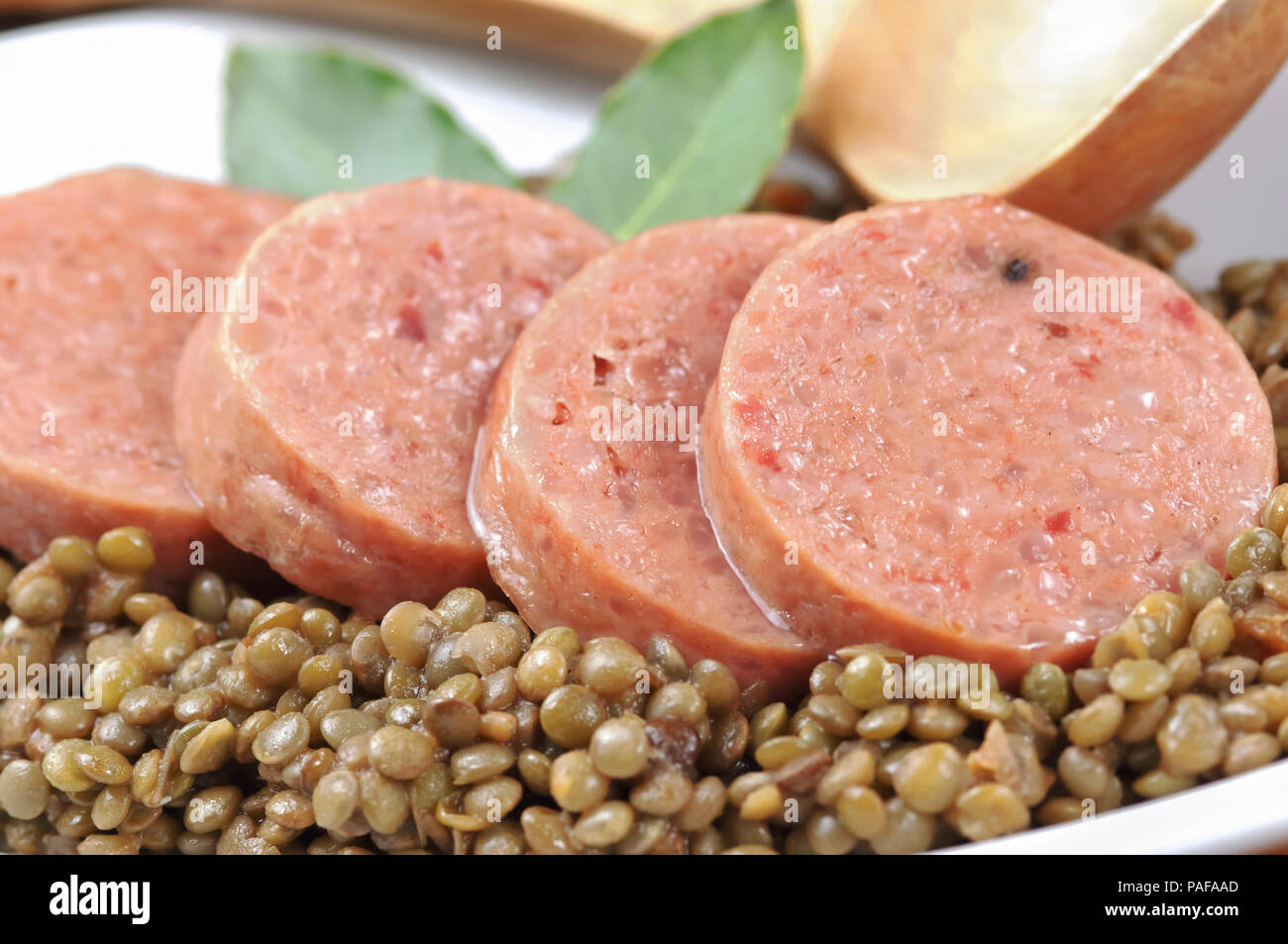 Italian cotechino with lentils on Christmas table Stock Photo - Alamy