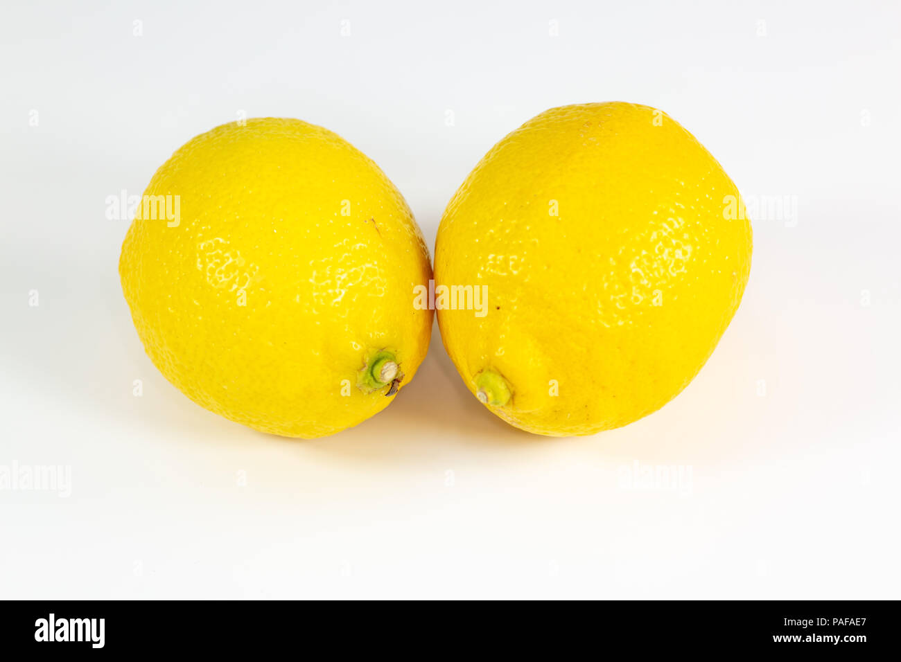 Two whole lemons sliced hi-res stock photography and images - Alamy