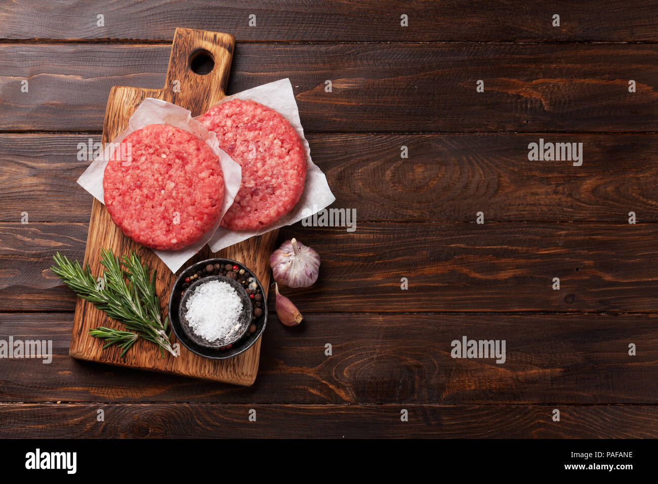 Tasty grilled home made burgers cooking. Top view with space for your ...