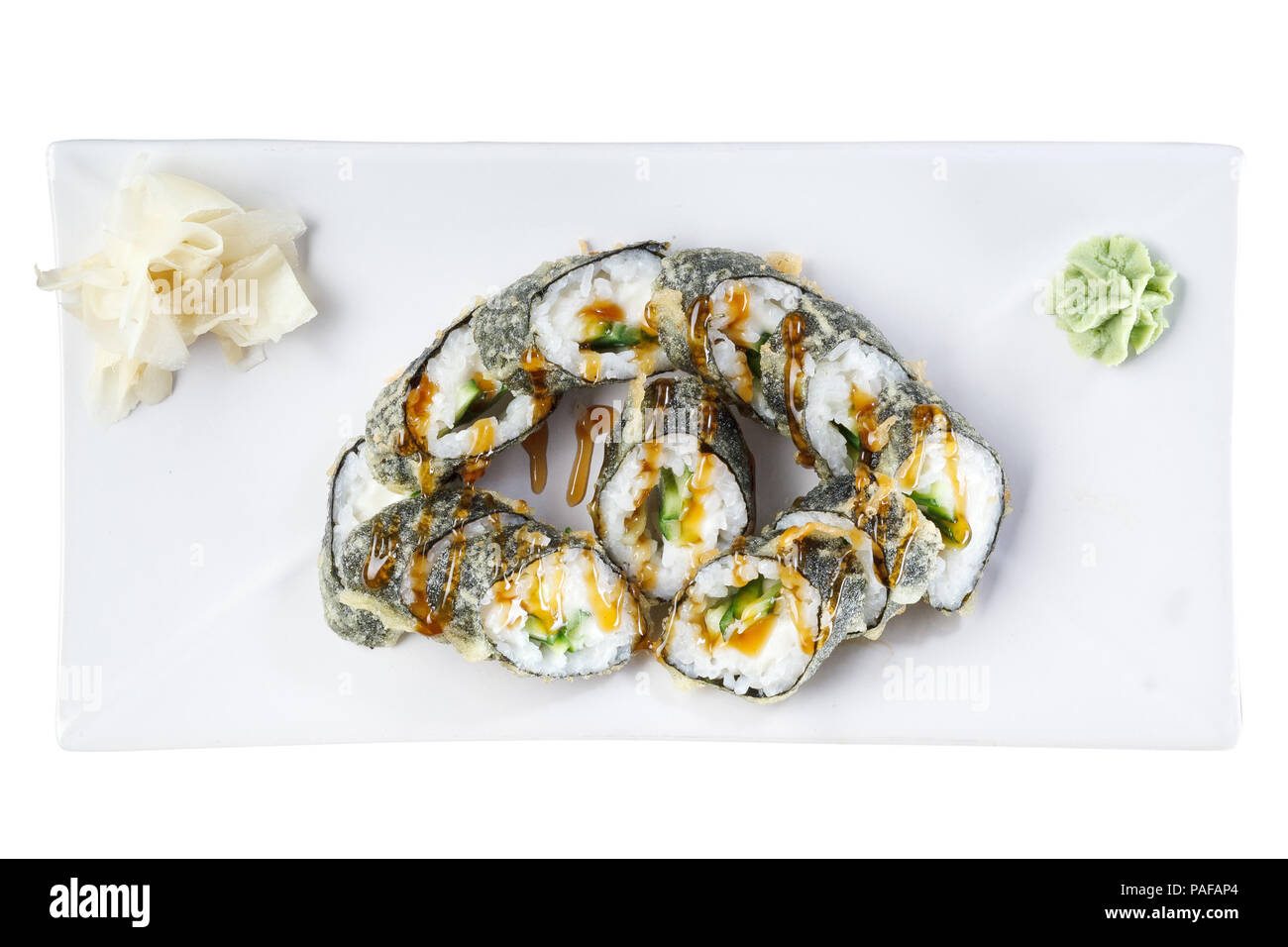 Sushi rolls with tuna and flying fish roe on a plate with wasabi and ...