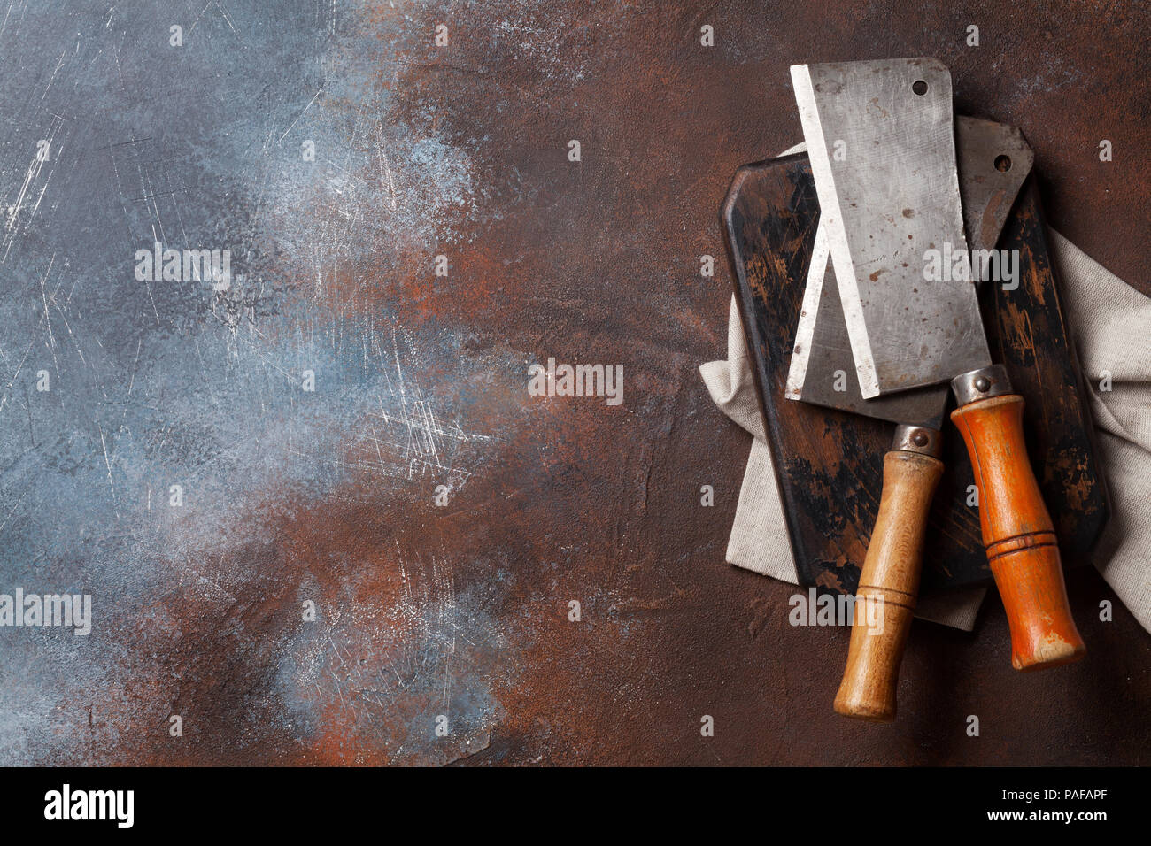 Vintage kitchen utensils over cutting board. Meat cleaver. Cooking ...