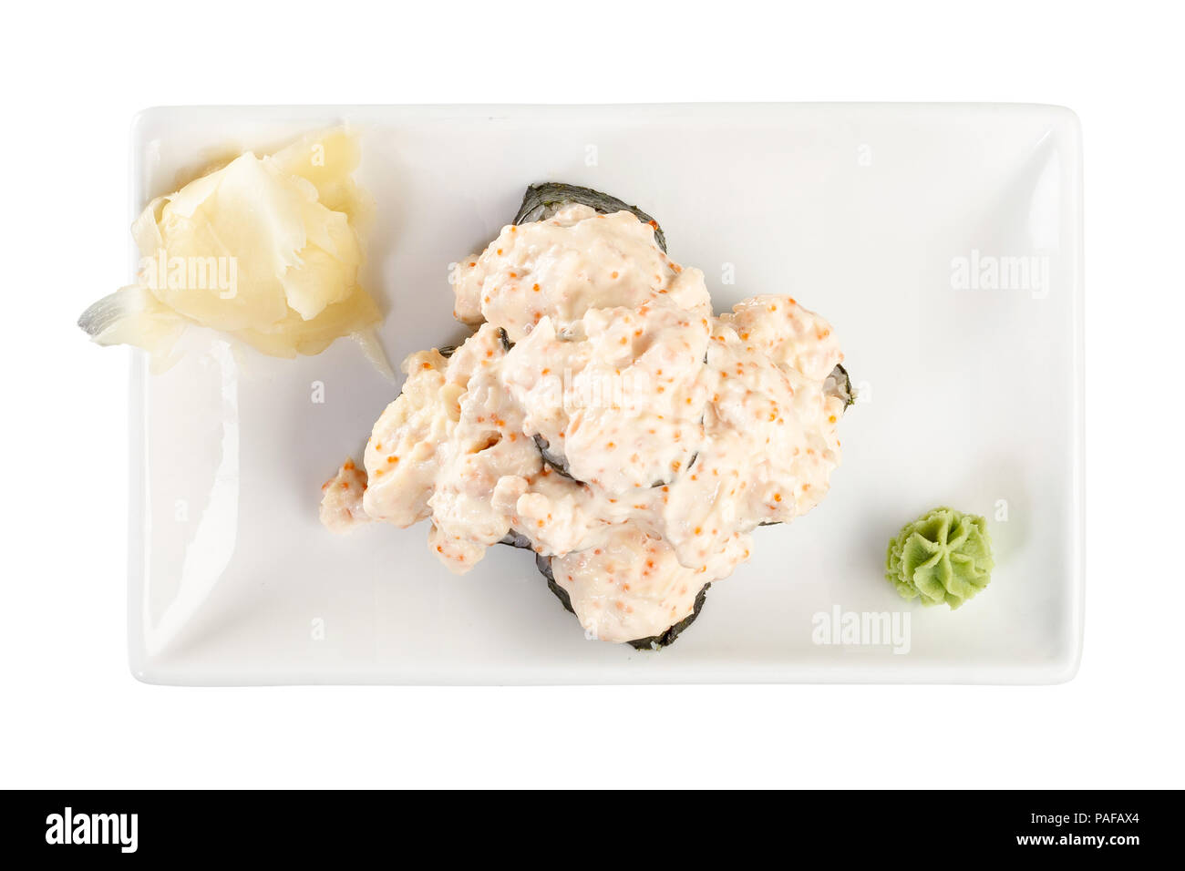 Sushi rolls with tuna and flying fish roe on a plate with wasabi and ...