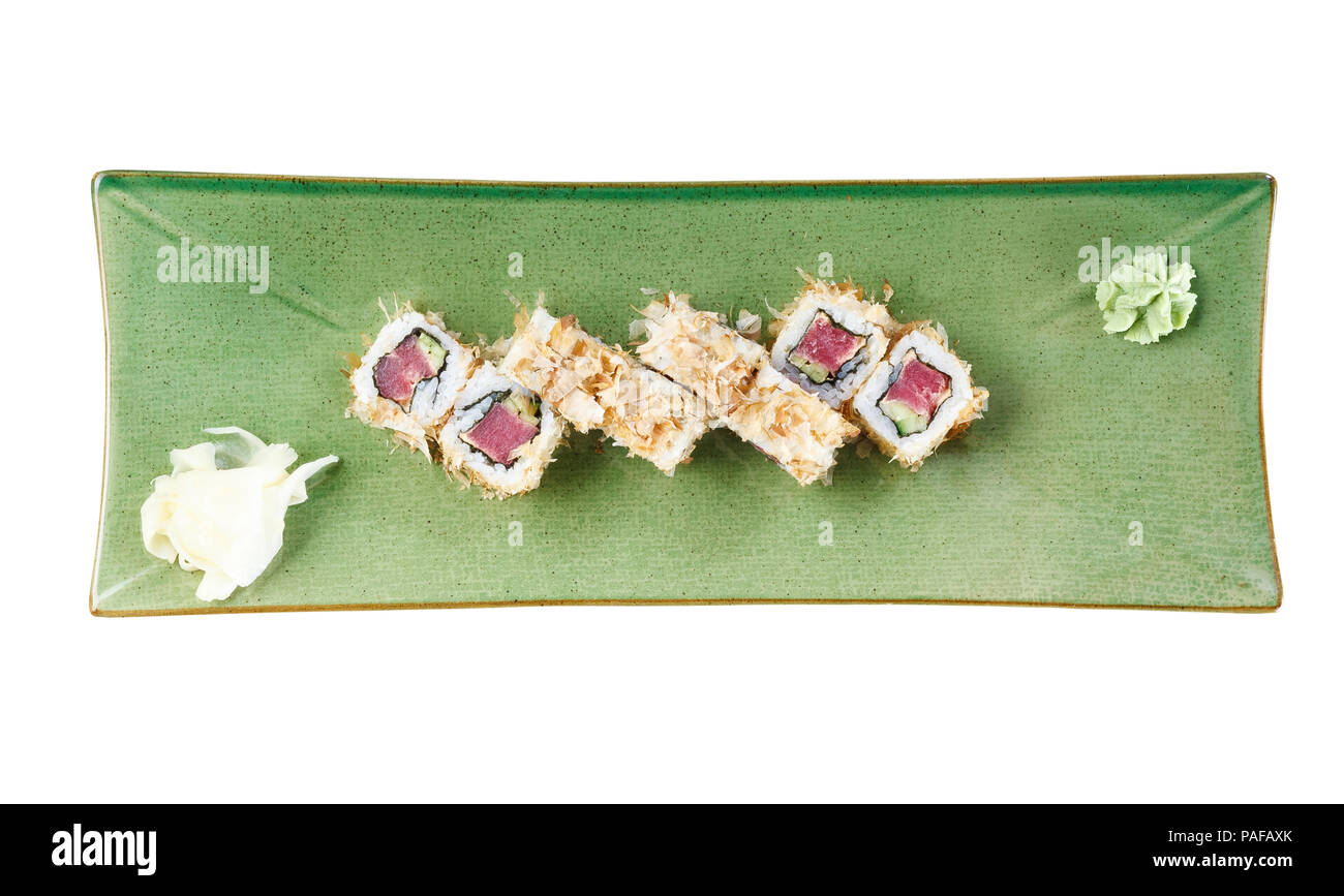 Sushi rolls with tuna and flying fish roe on a plate with wasabi and ...