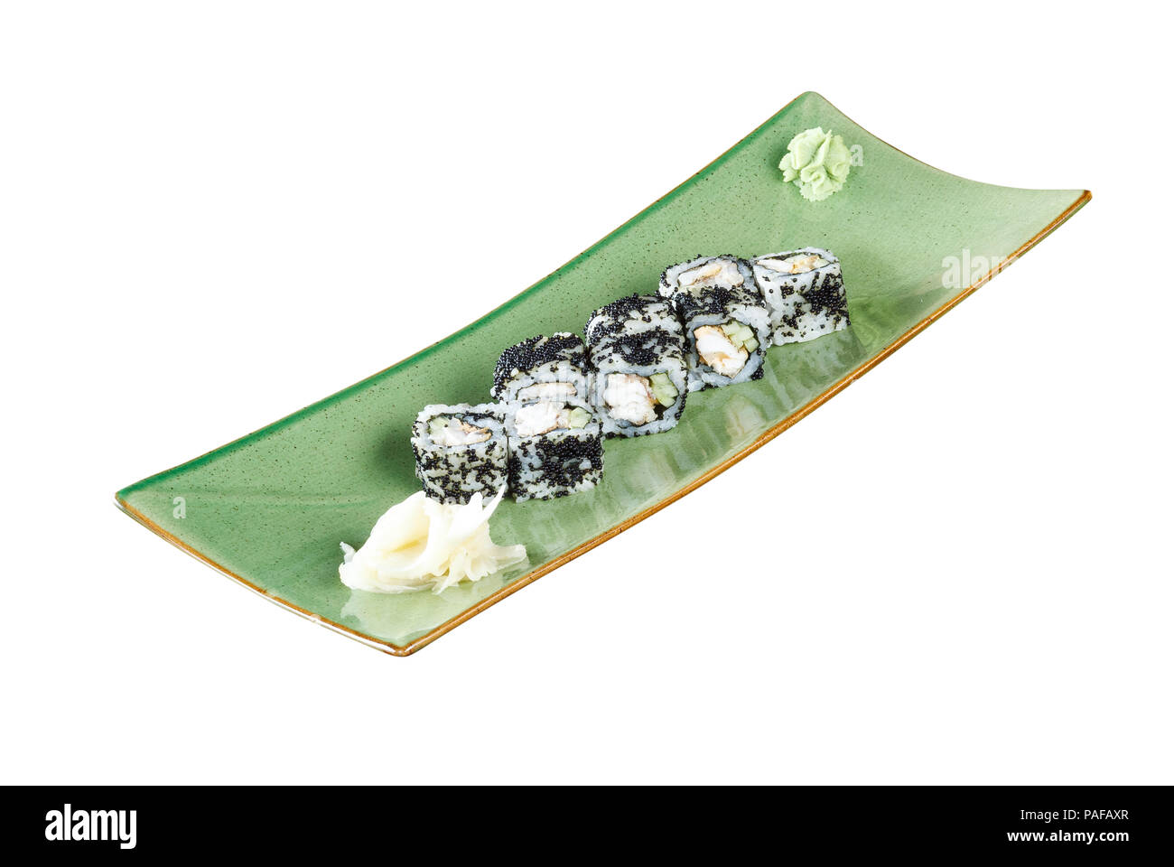 Sushi rolls with tuna and flying fish roe on a plate with wasabi and ...