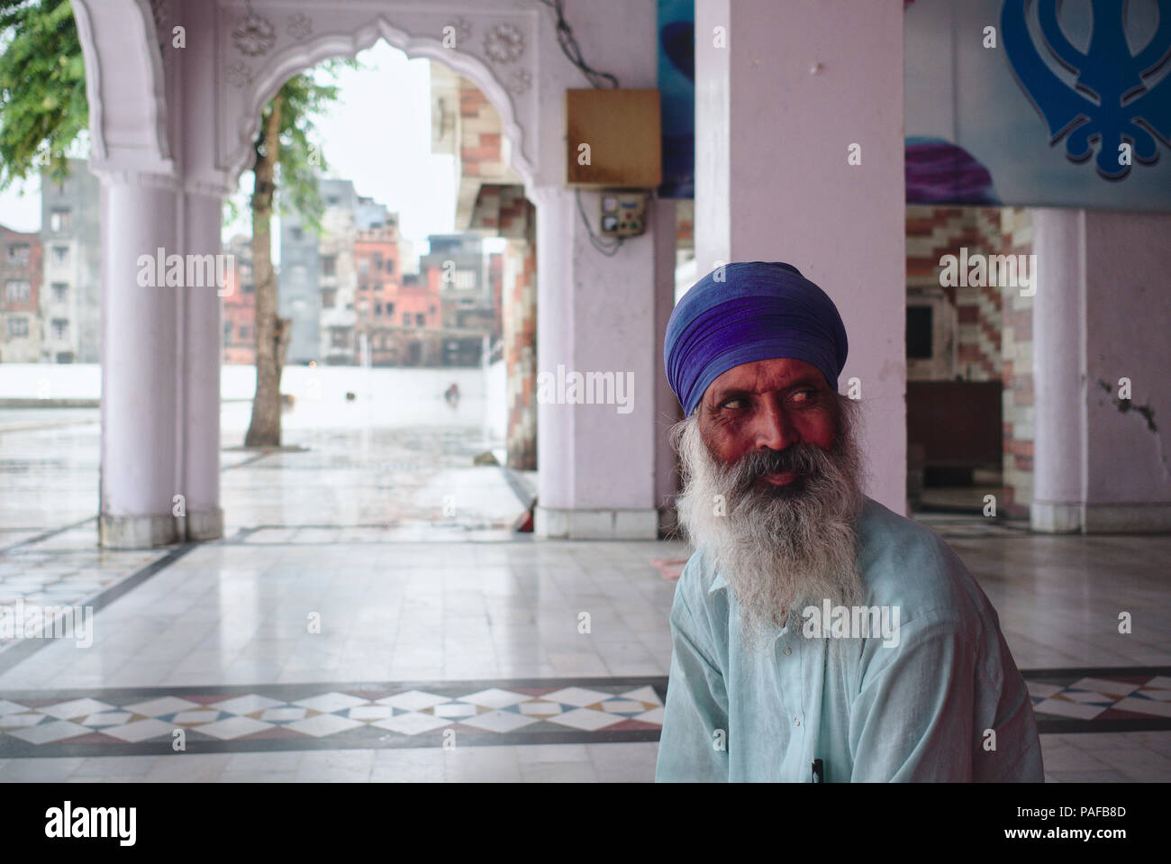 Sikh elderly man at Santokhsar, one of five sarovars (sacred pools) of ...