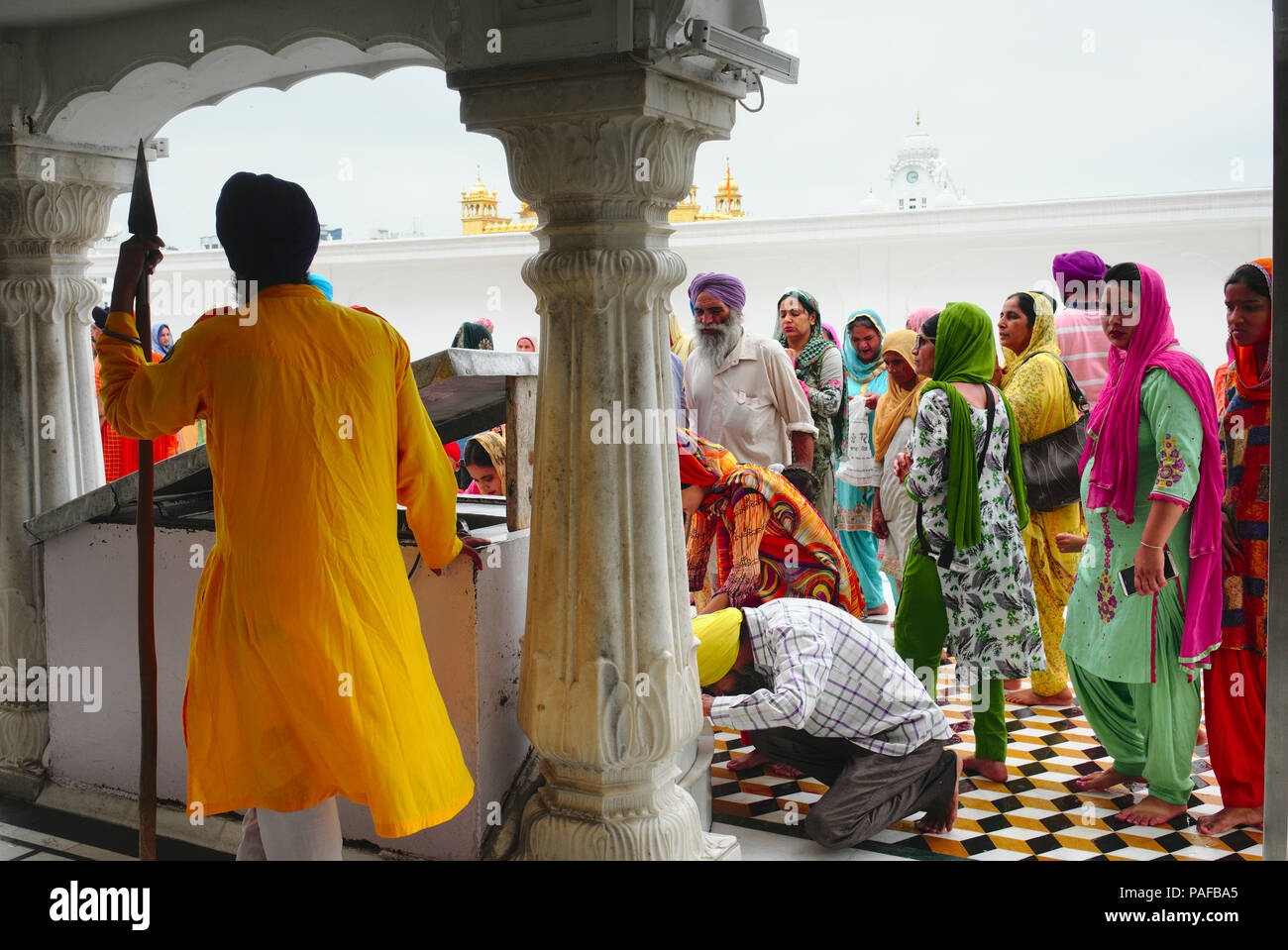 Guard men at the Golden Temple, monitoring visitors and ensuring sacred ...