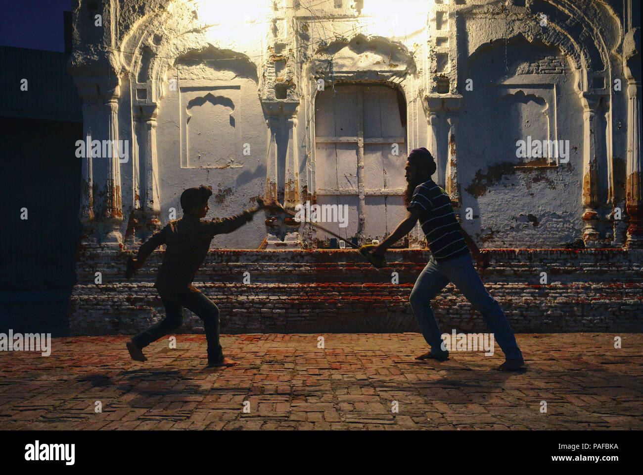 Sikh young men practicing Gutka, the sikh martial art Stock Photo - Alamy