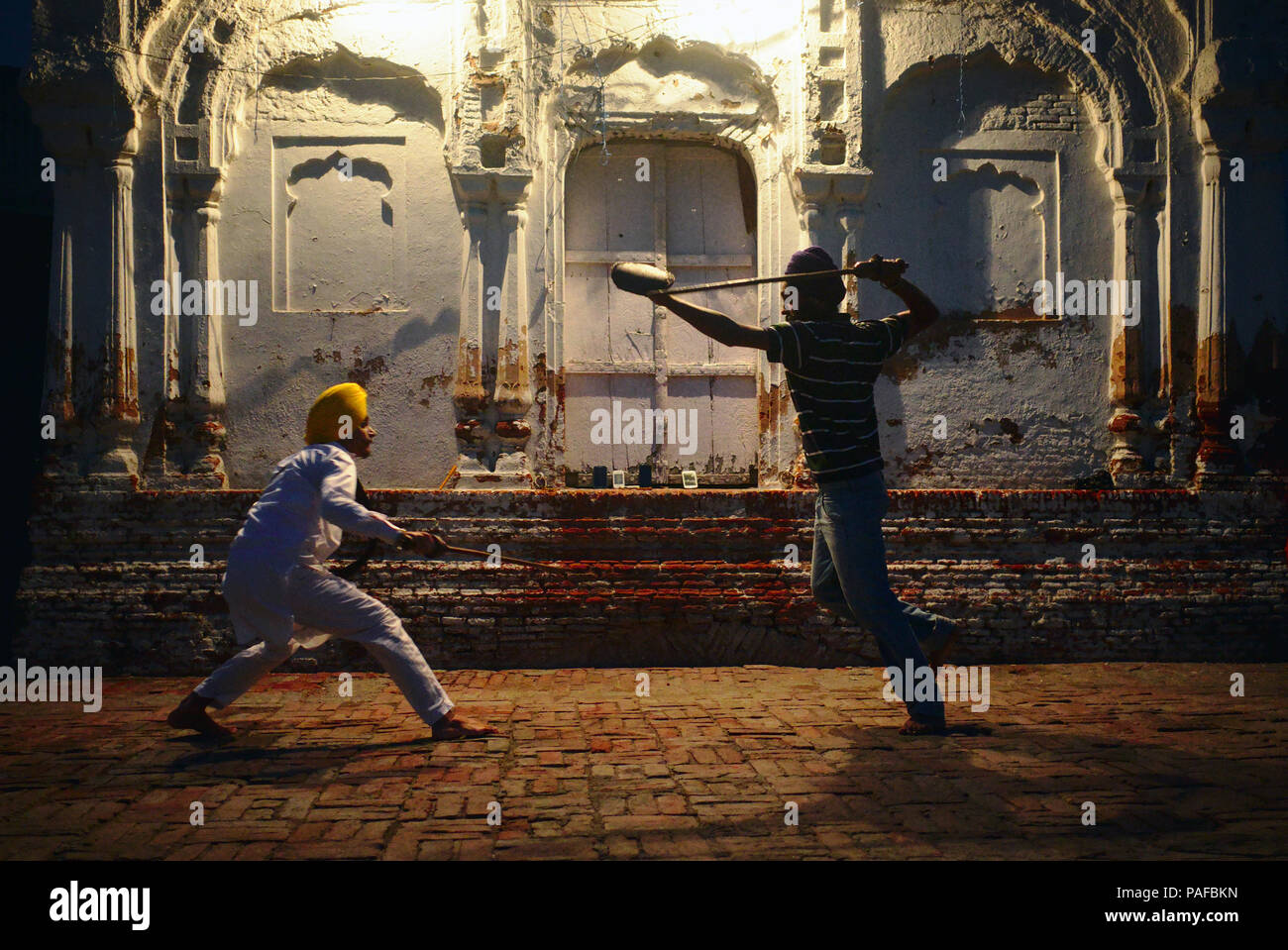 Sikh young men practicing Gutka, the sikh martial art Stock Photo - Alamy