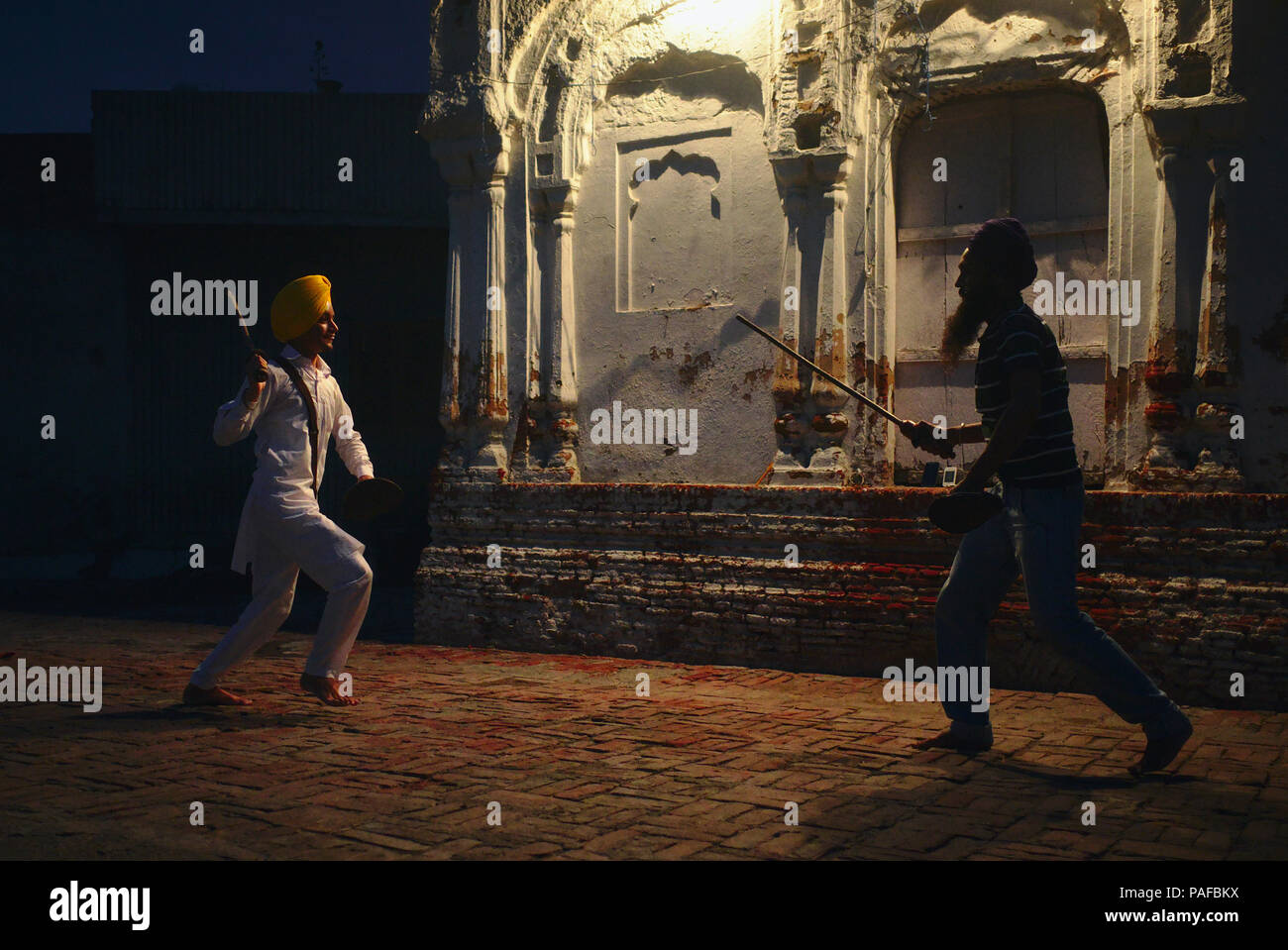 Sikh young men practicing Gutka, the sikh martial art Stock Photo - Alamy