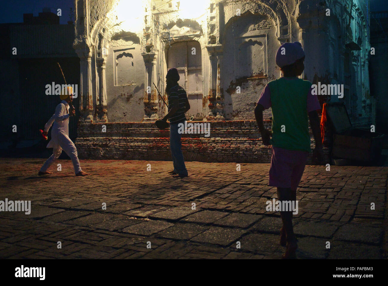 Sikh young men practicing Gutka, the sikh martial art Stock Photo - Alamy
