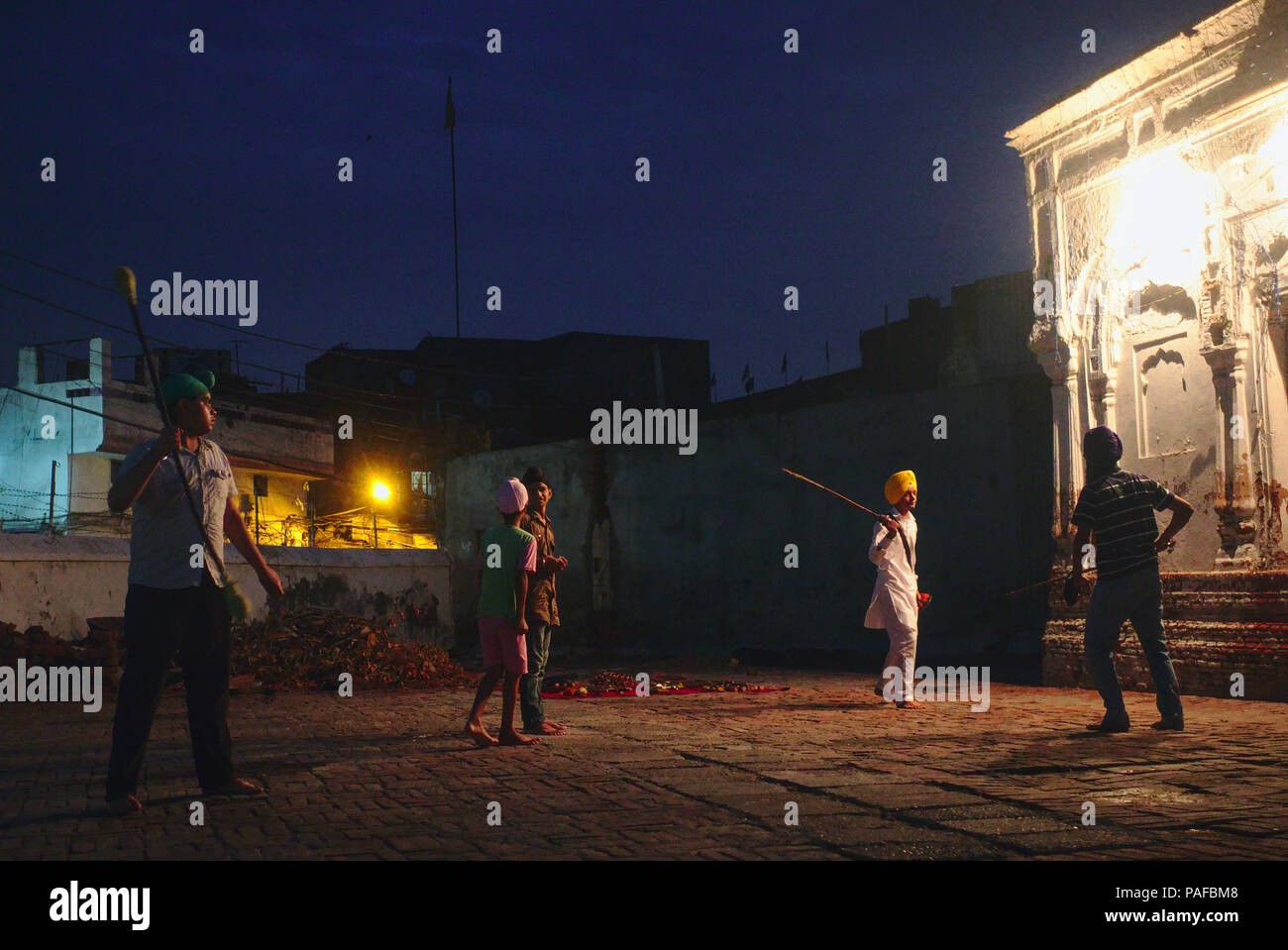 Sikh young men practicing Gutka, the sikh martial art Stock Photo - Alamy