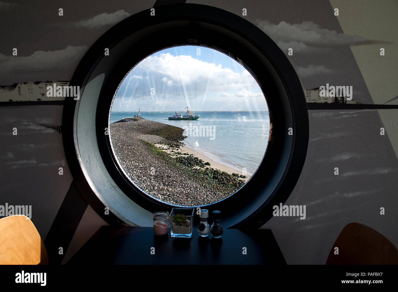 Round window in the restaurant. Copy space Stock Photo - Alamy