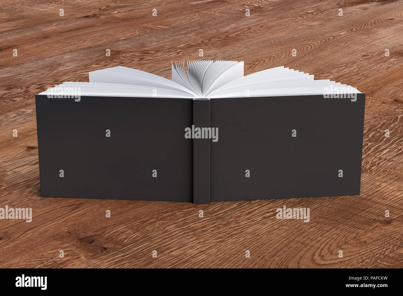 Black blank horizontal book cover standing isolated on wooden ...